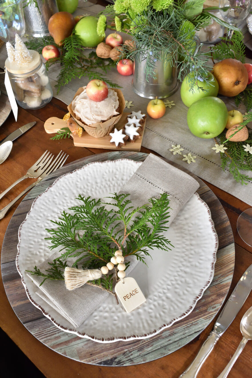 A Christmas table set with simple yet festive holiday details!